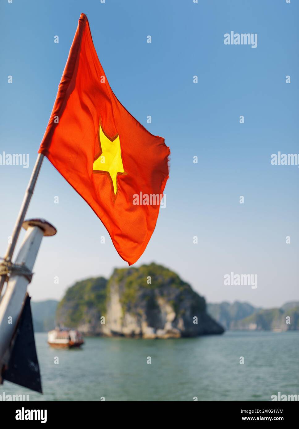 The flag of Vietnam fluttering on ship, the Ha Long Bay Stock Photo - Alamy