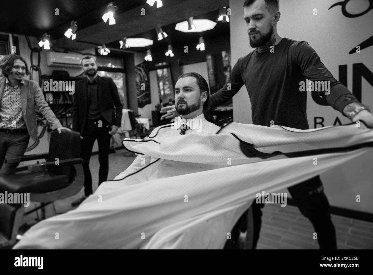 bearded man cutting his beard in the barbershop at the master Stock ...