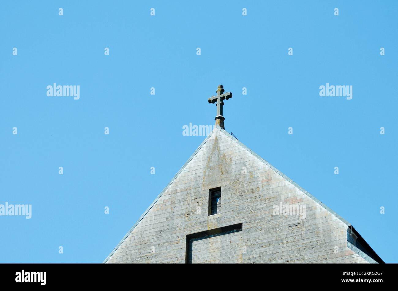 A cross on a building Stock Photo - Alamy