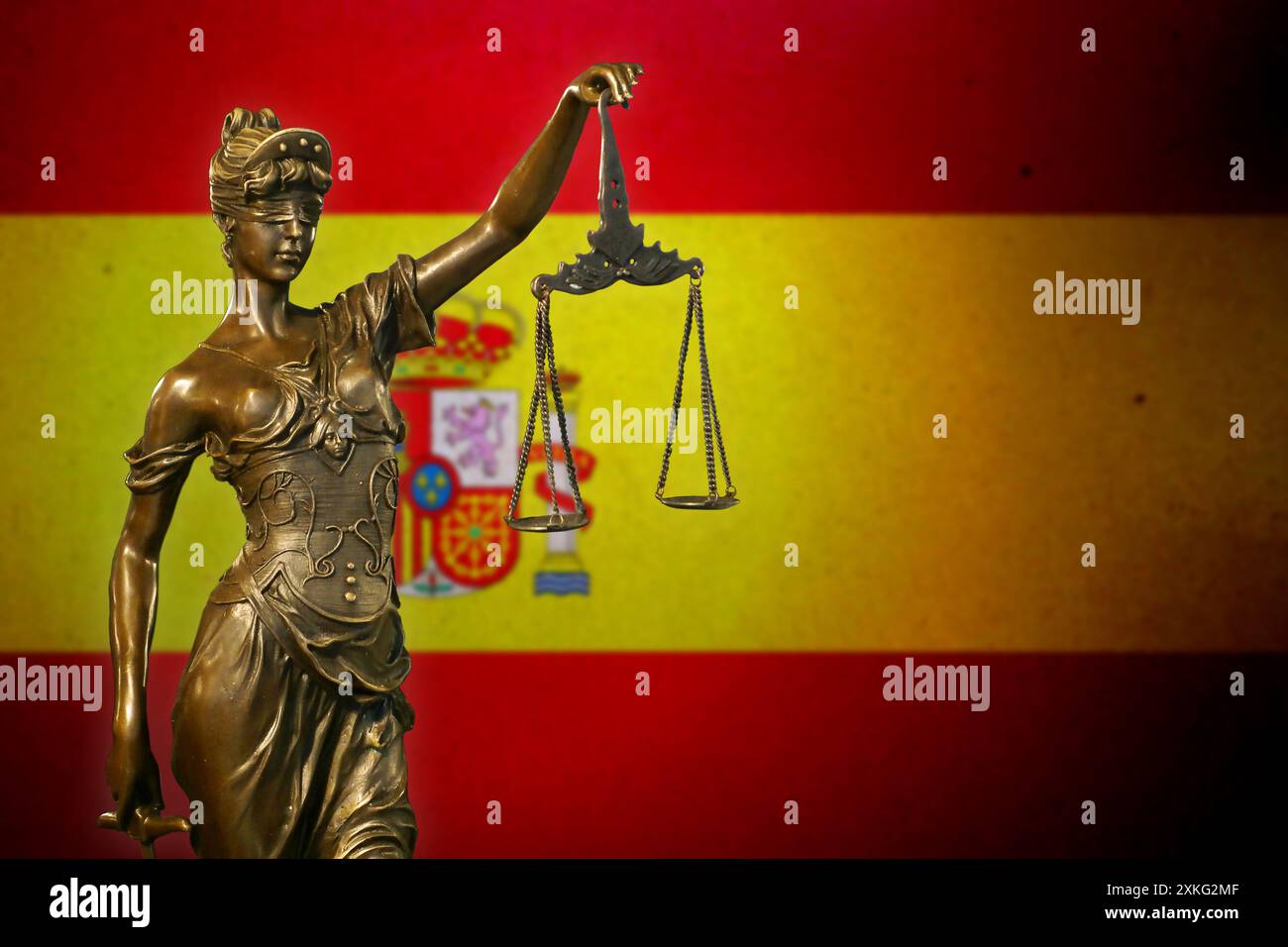 Close-up of a small bronze statuette of Lady Justice before a Spanish ...