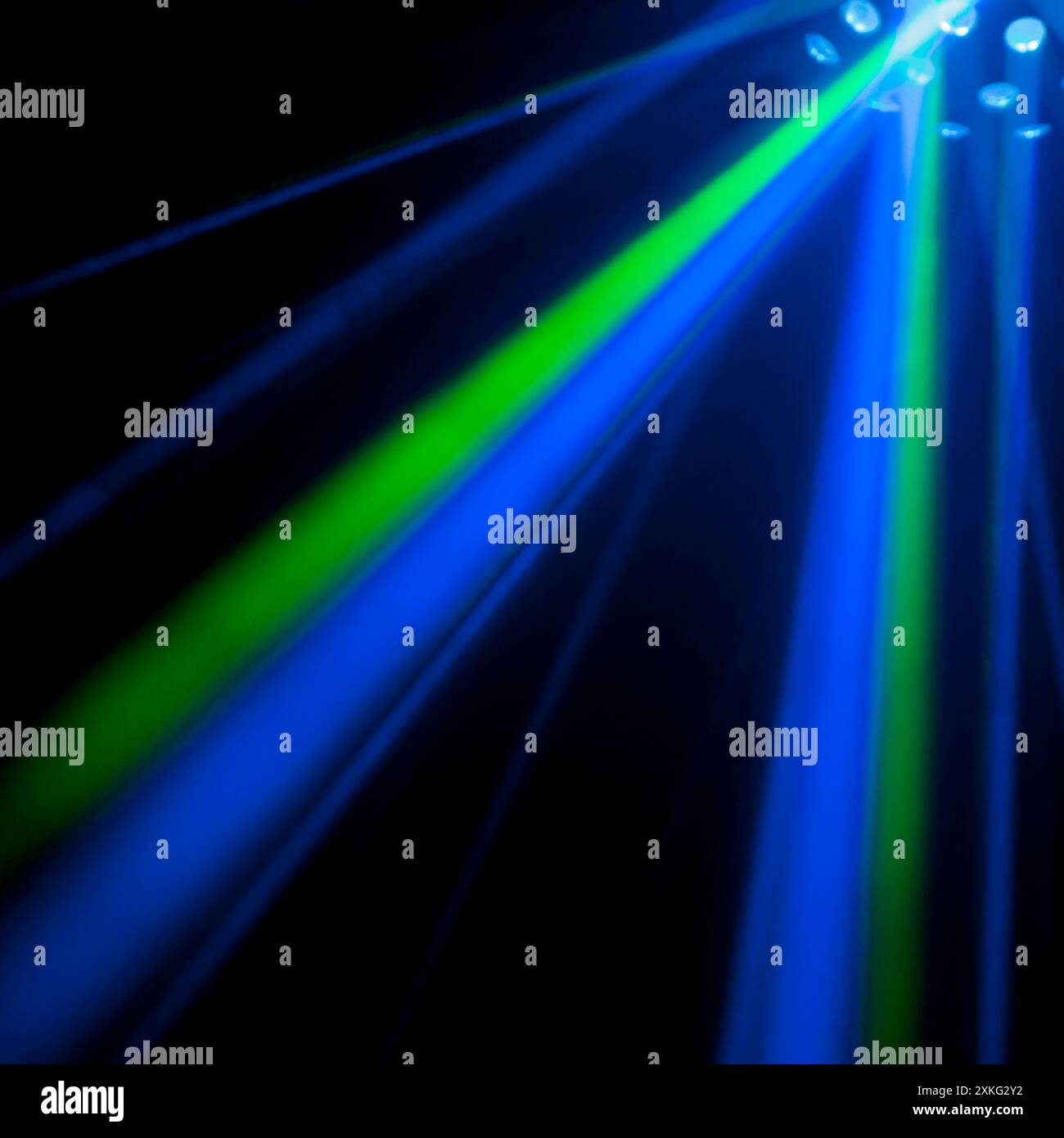 Colorful laser beam piercing into the darkness Stock Photo - Alamy