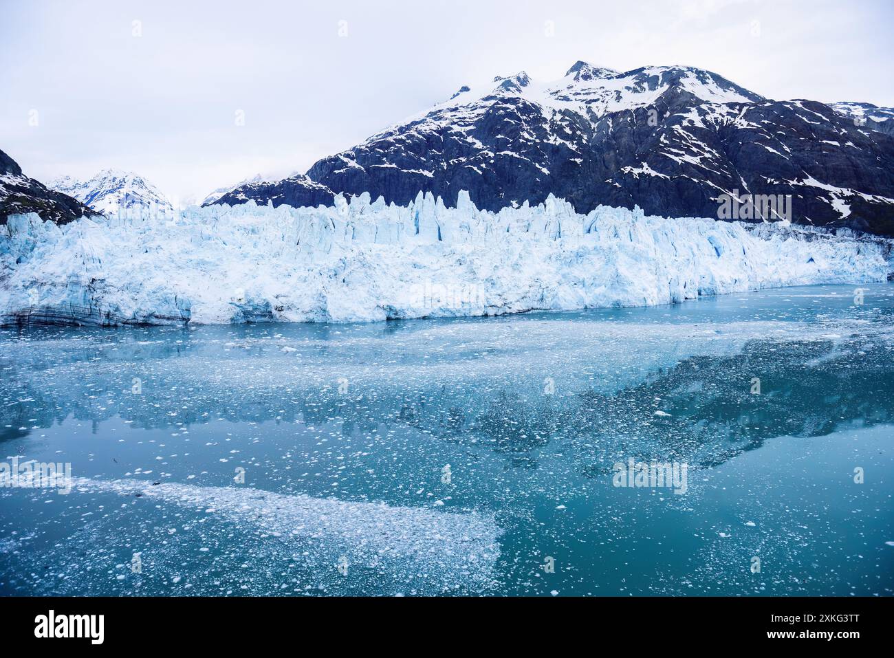 Glacier and mountains reflected in cold waters at Glacier Bay National ...