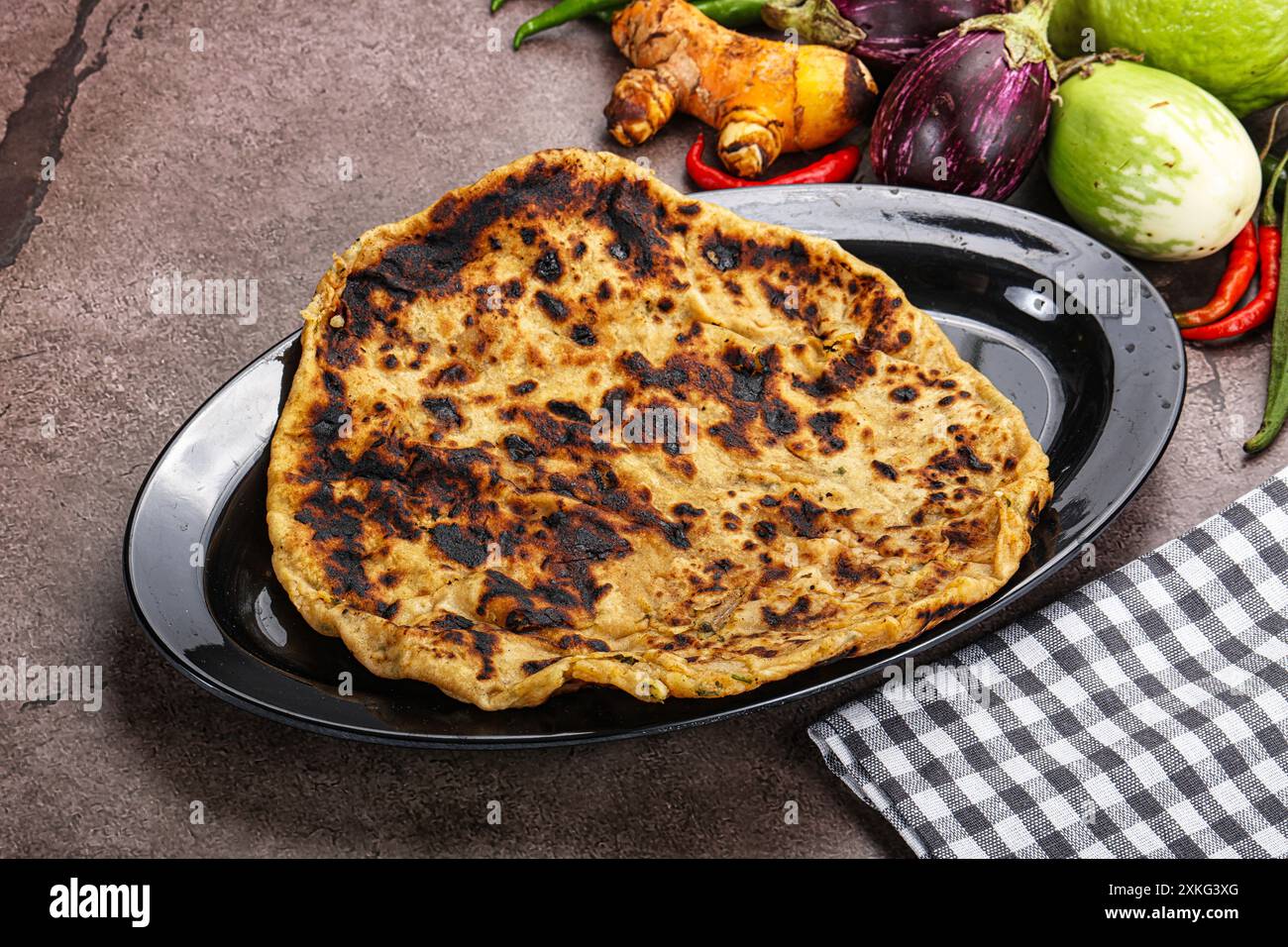 Indian cuisine stuffed Aloo paratha - bread with potato Stock Photo - Alamy