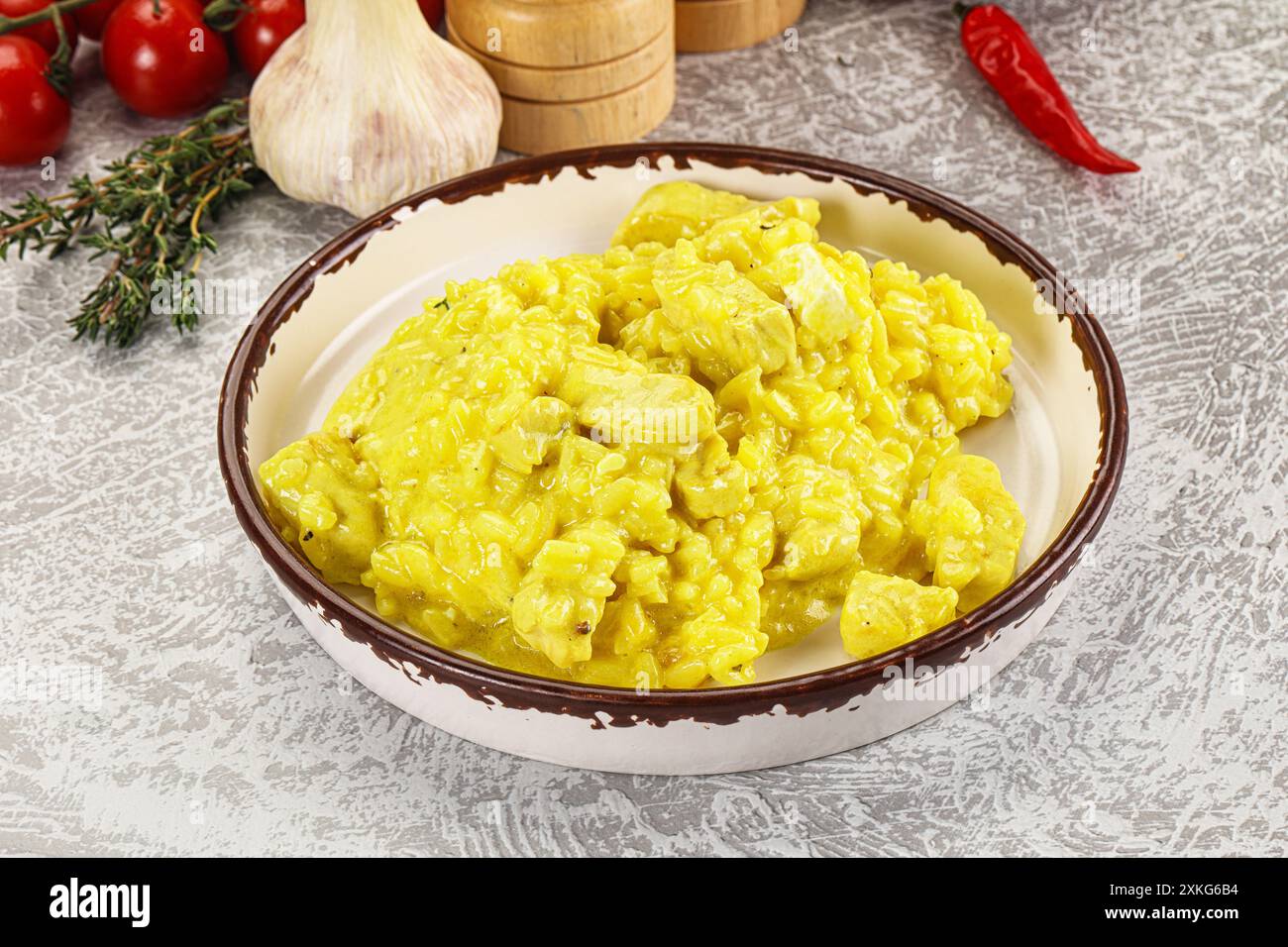 Italian cuisine - yellow risotto with chicken and soft cheese Stock ...