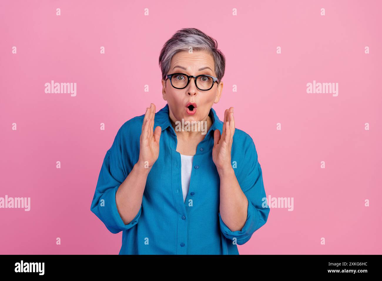 Photo portrait of lovely pensioner lady raise hands shocked dressed ...