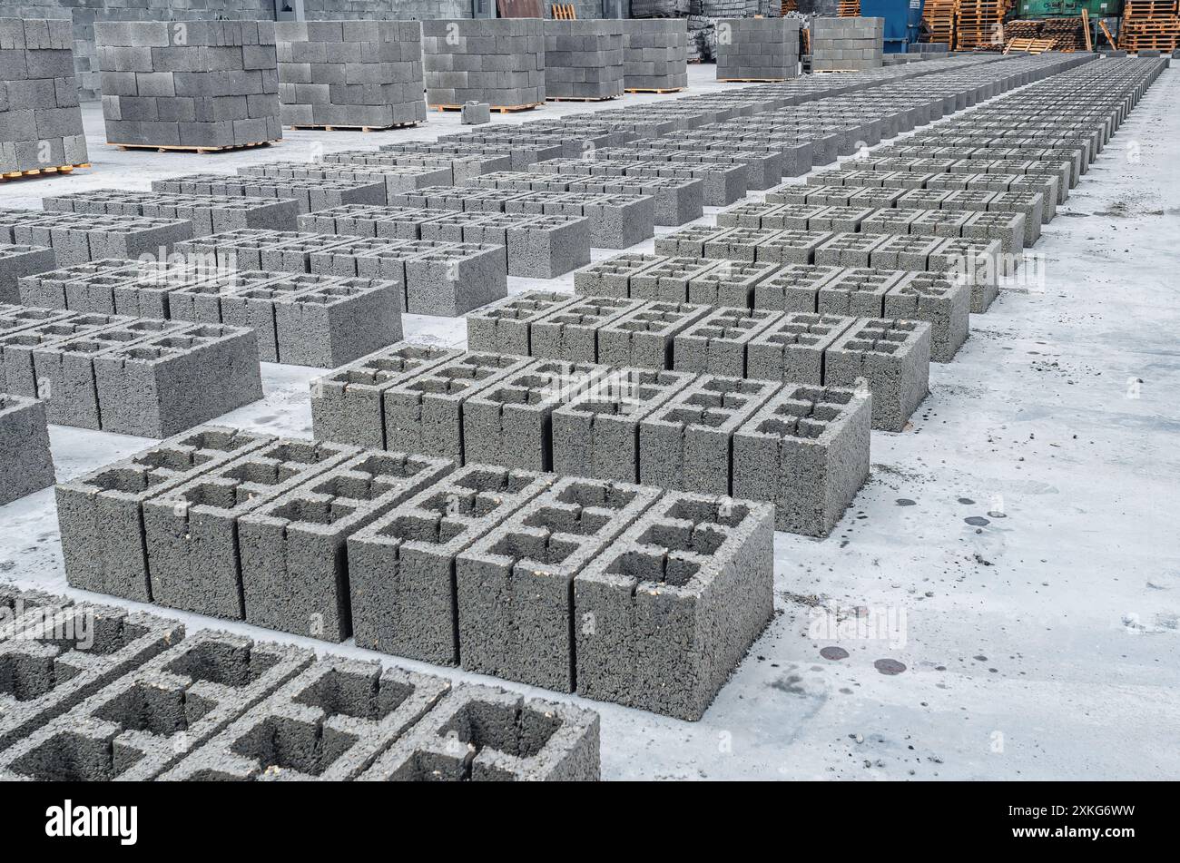 Rows of concrete cinder blocks, building material in form of gray ...