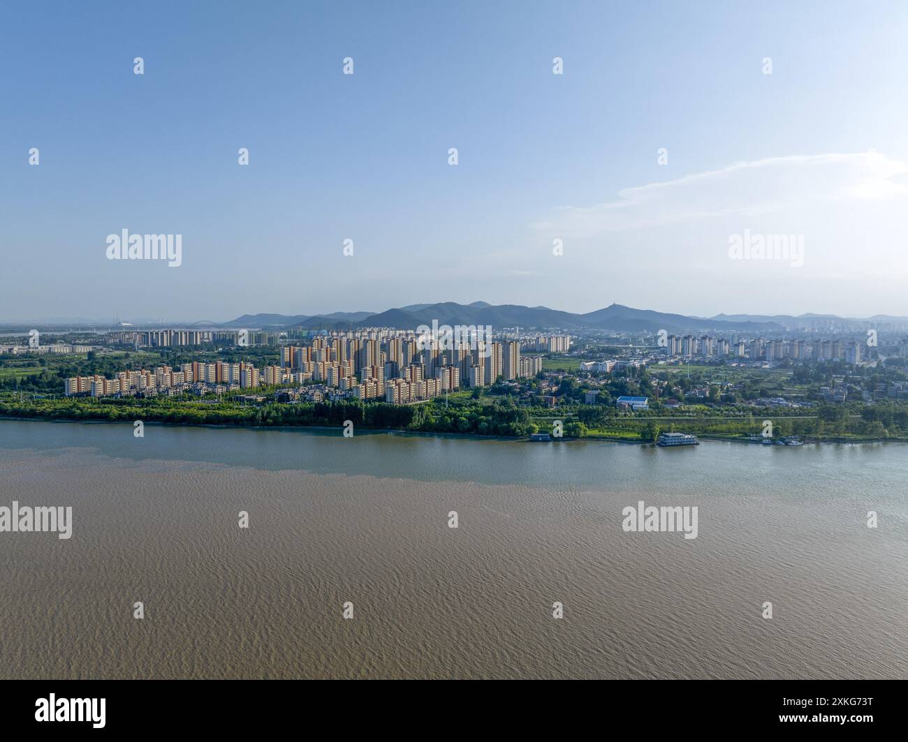 Aerial view shows the green-yellow Han River in Xiangyang City, central ...