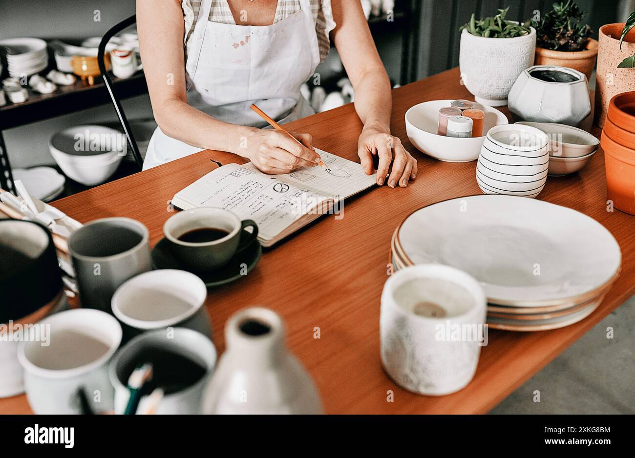 Pottery owner woman writing hi-res stock photography and images - Alamy