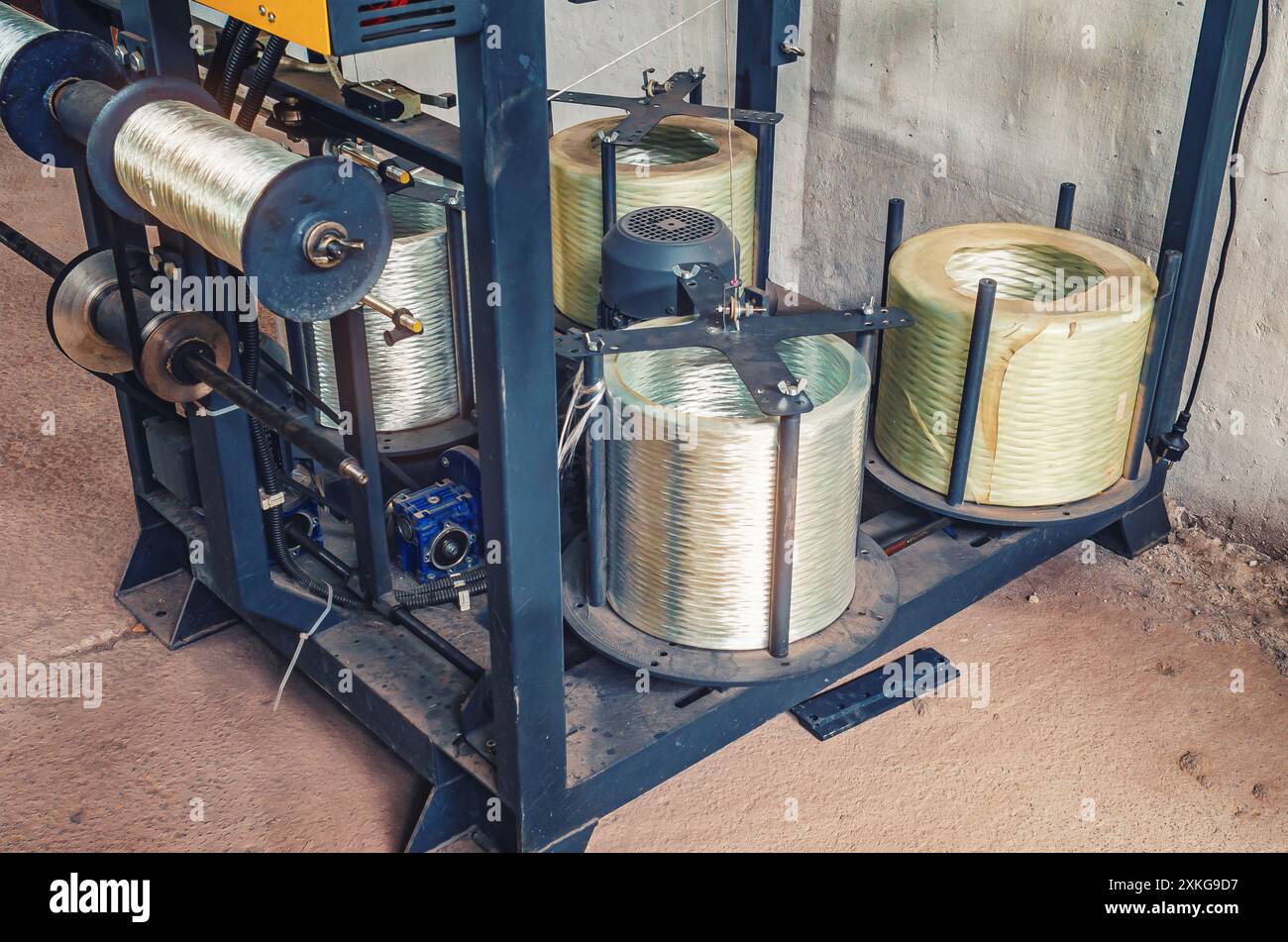 Coils of plastic wire in workshop. Spinning and winding of plastic ...
