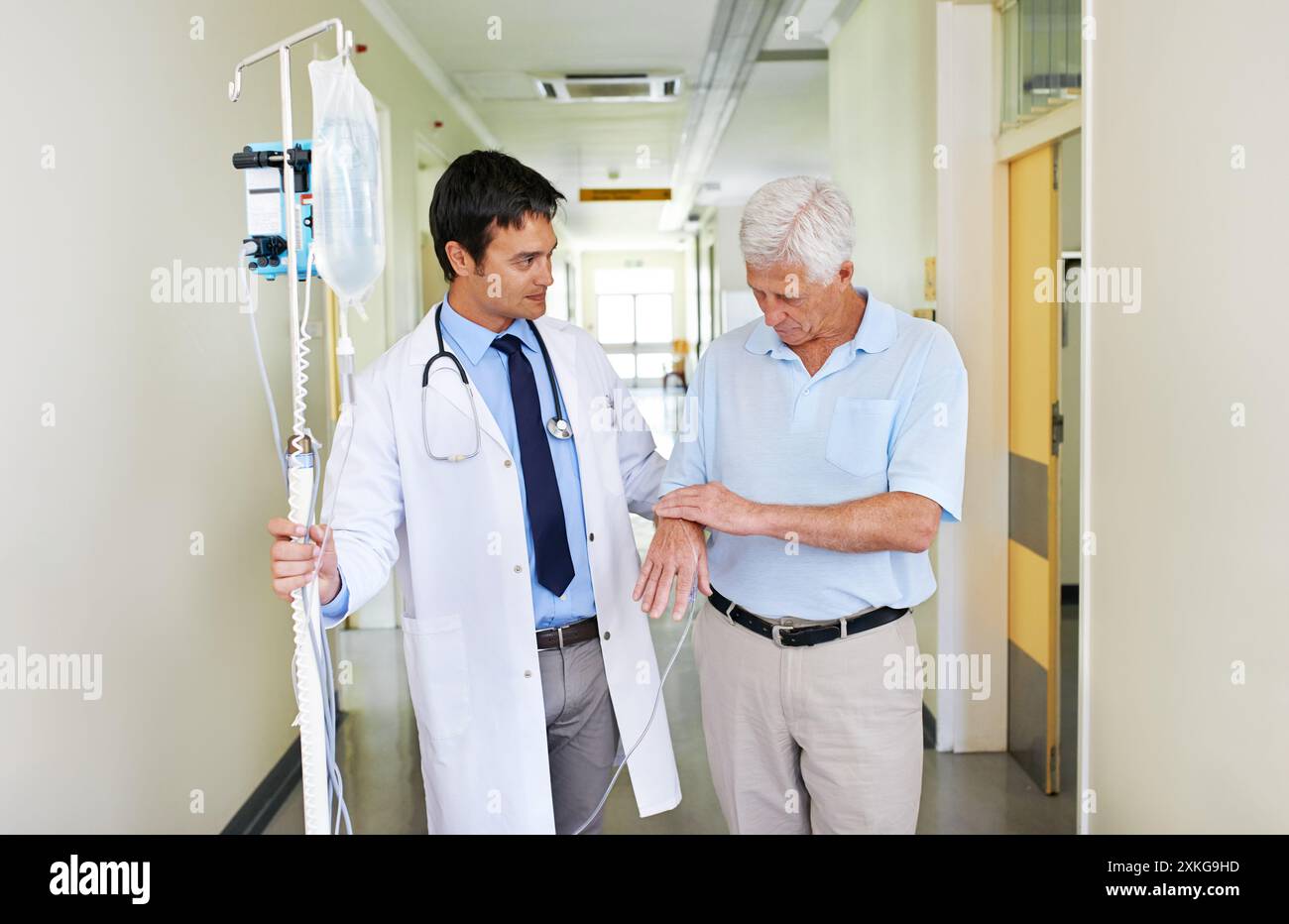 Hospital, walking and doctor with patient, IV drip and elderly person ...