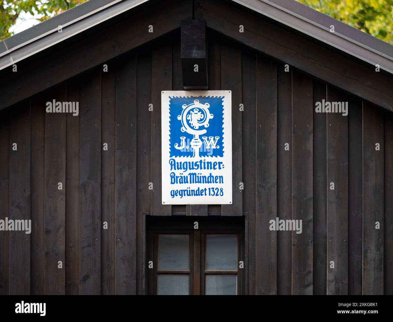 Augustiner-Bräu München logo on a wooden building exterior ...