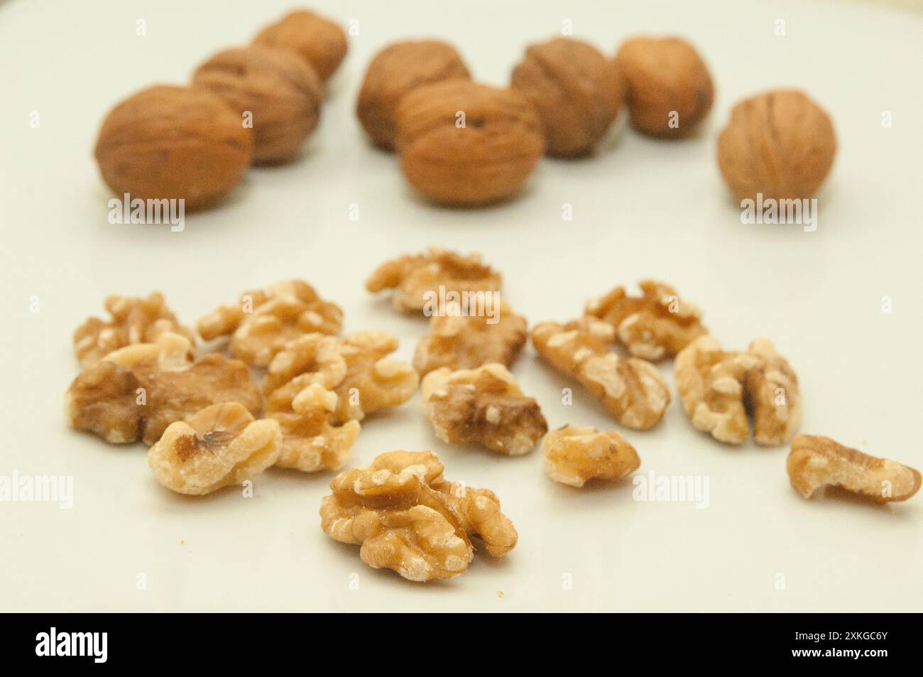 Walnuts with and without shell, on white background Stock Photo - Alamy