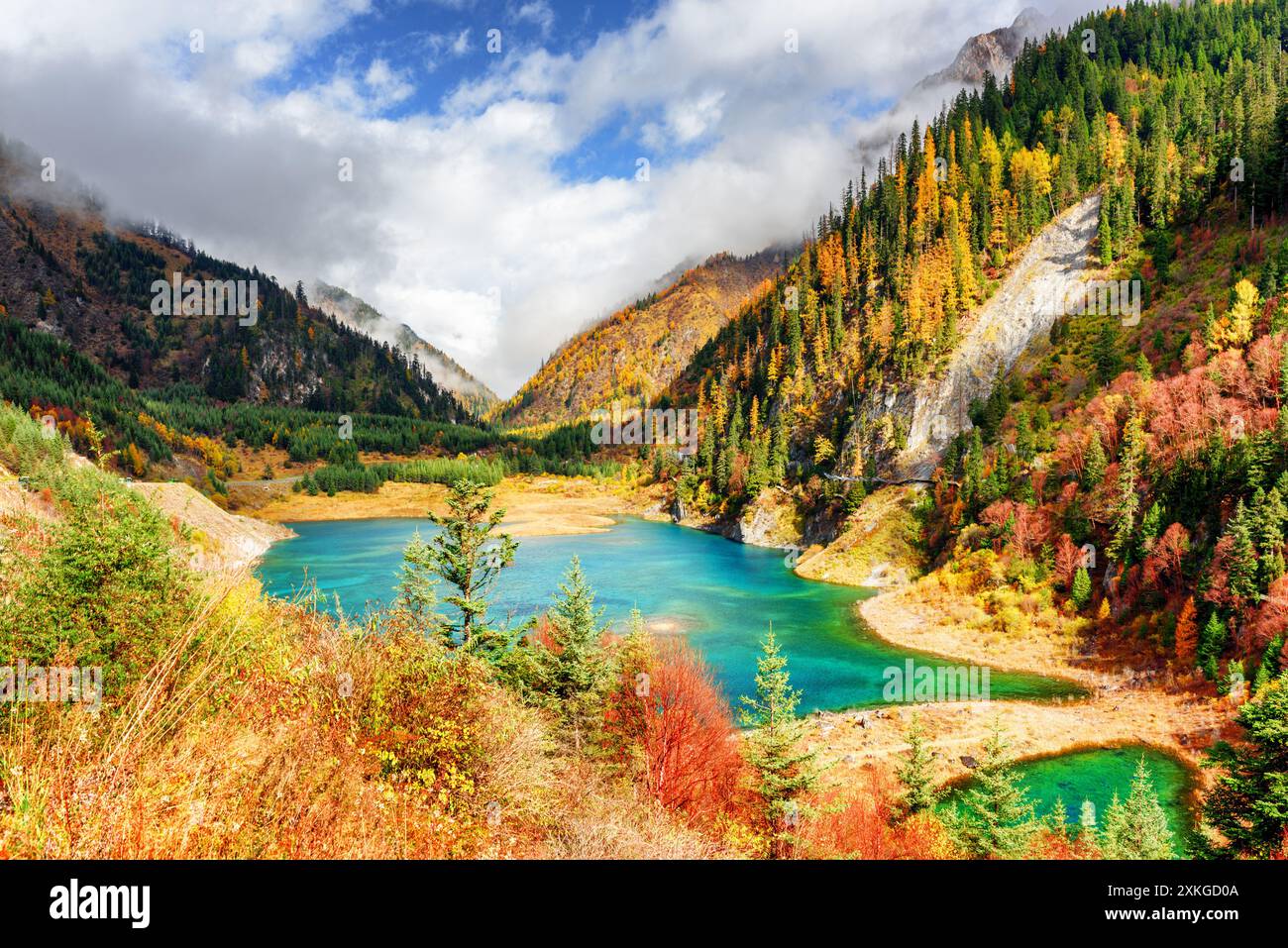 The Upper Seasonal Lake with azure water among fall woods Stock Photo ...