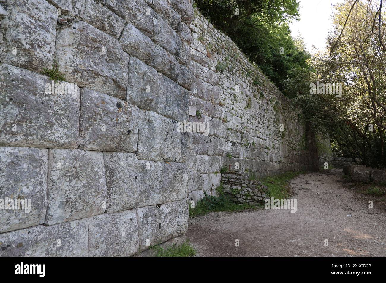 The old city wall of the ancient remains of the ruined city of Butrint ...