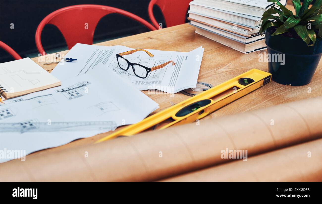 Project, design and architecture in office with blueprint, drawing and ...