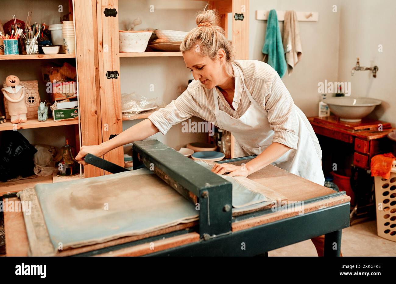 Production, woman and clay press in workshop for pottery, creativity ...