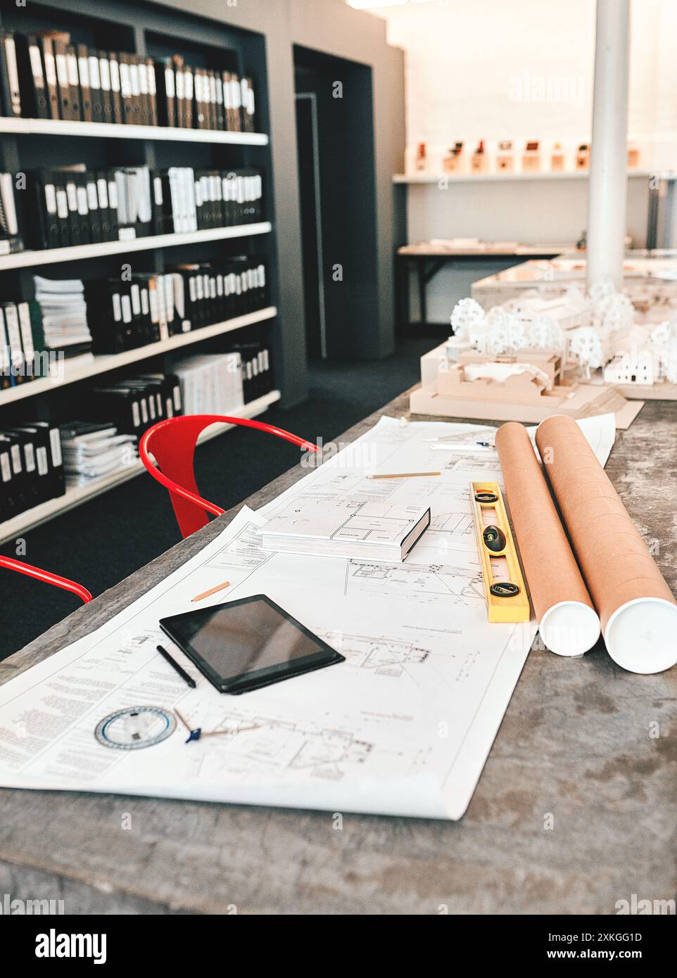 Paperwork, blueprint and equipment for architecture in office with ...