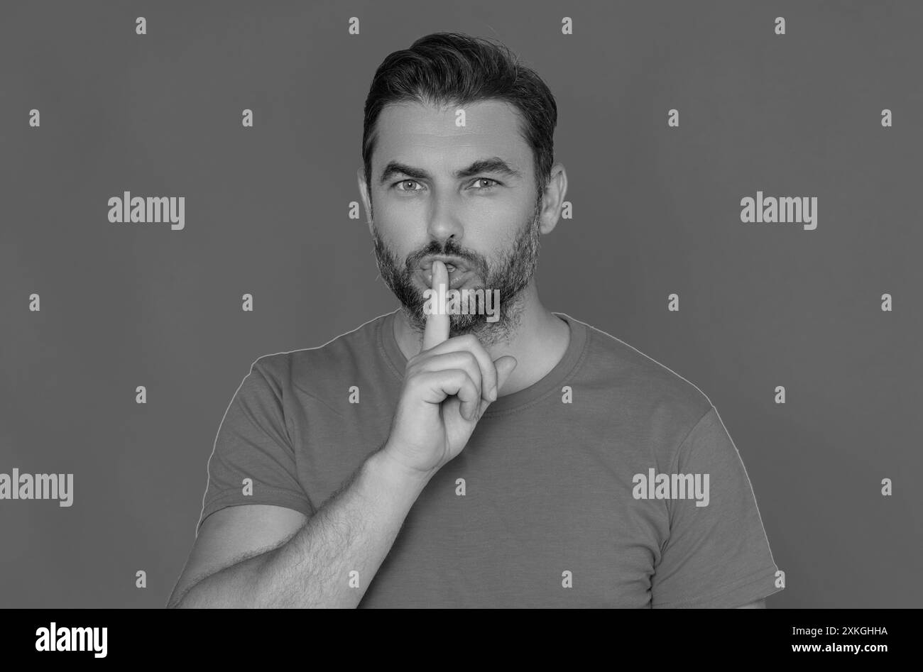 Boy finger on lips Black and White Stock Photos & Images - Alamy