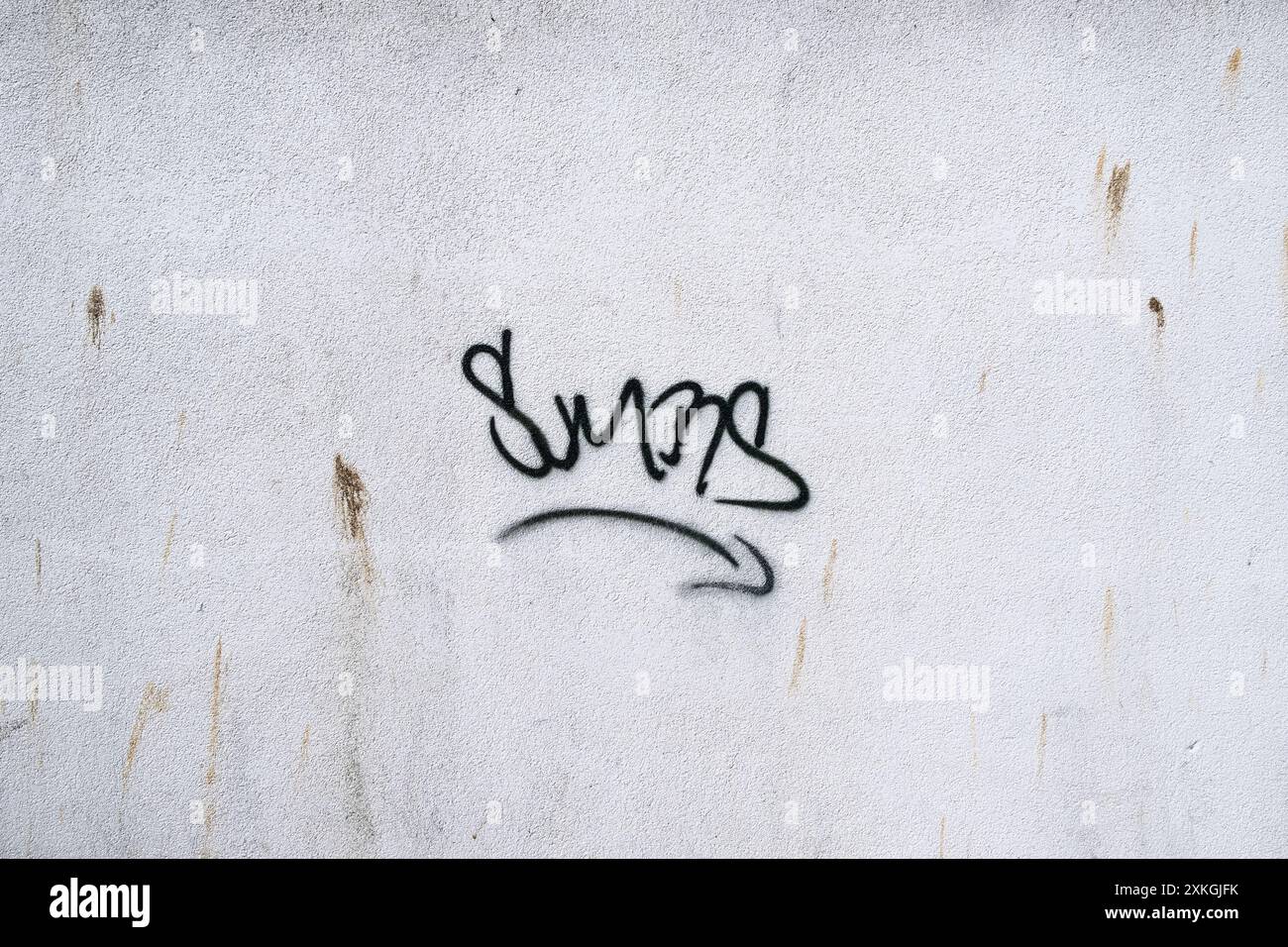 Ugly tag sprayed on a wall in Newquay Town centre in Cornwall in the UK ...
