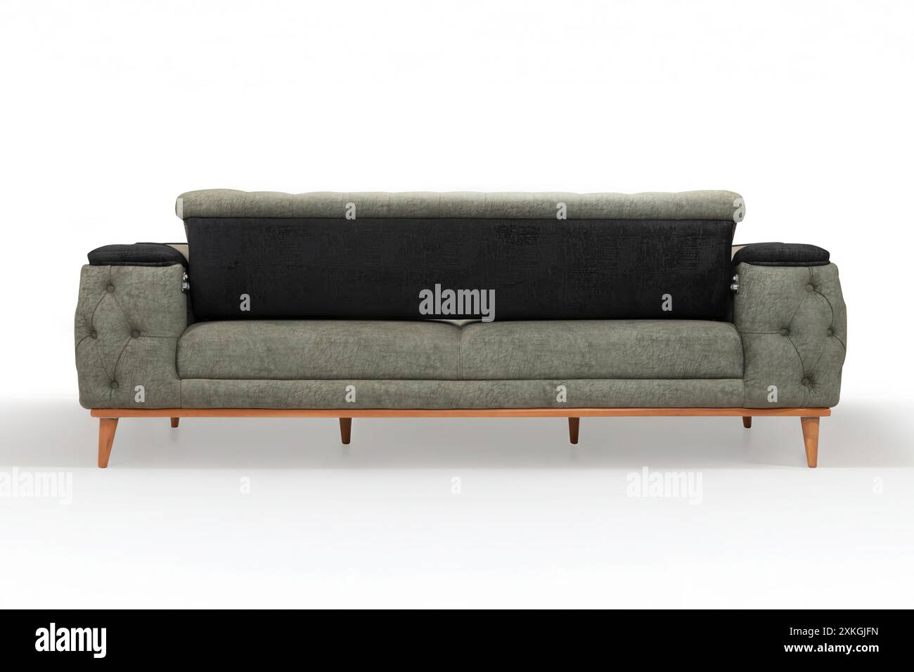 Back view of a grey and black tufted sofa with wooden legs ...