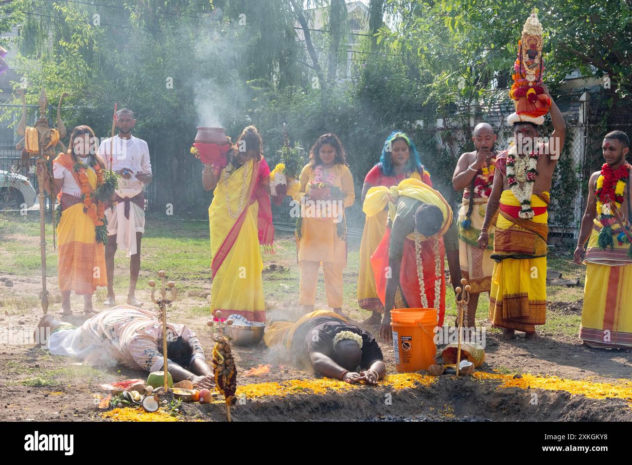 Prior to the Thimithi firewalk devout Hindus prostrate themselves near ...
