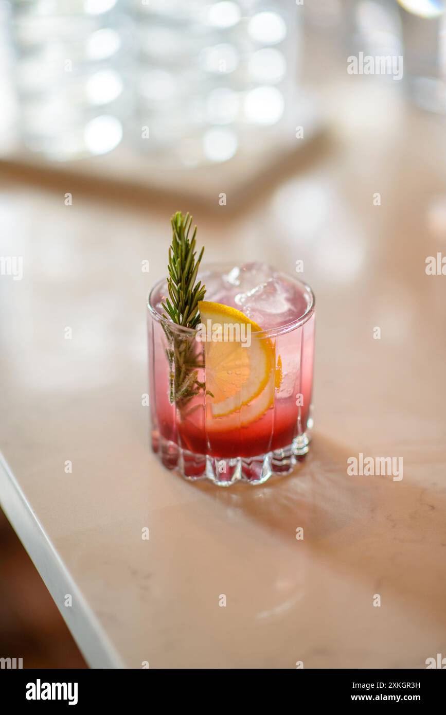Pomegranate Rosemary Infused water. Summer Cocktails Stock Photo - Alamy