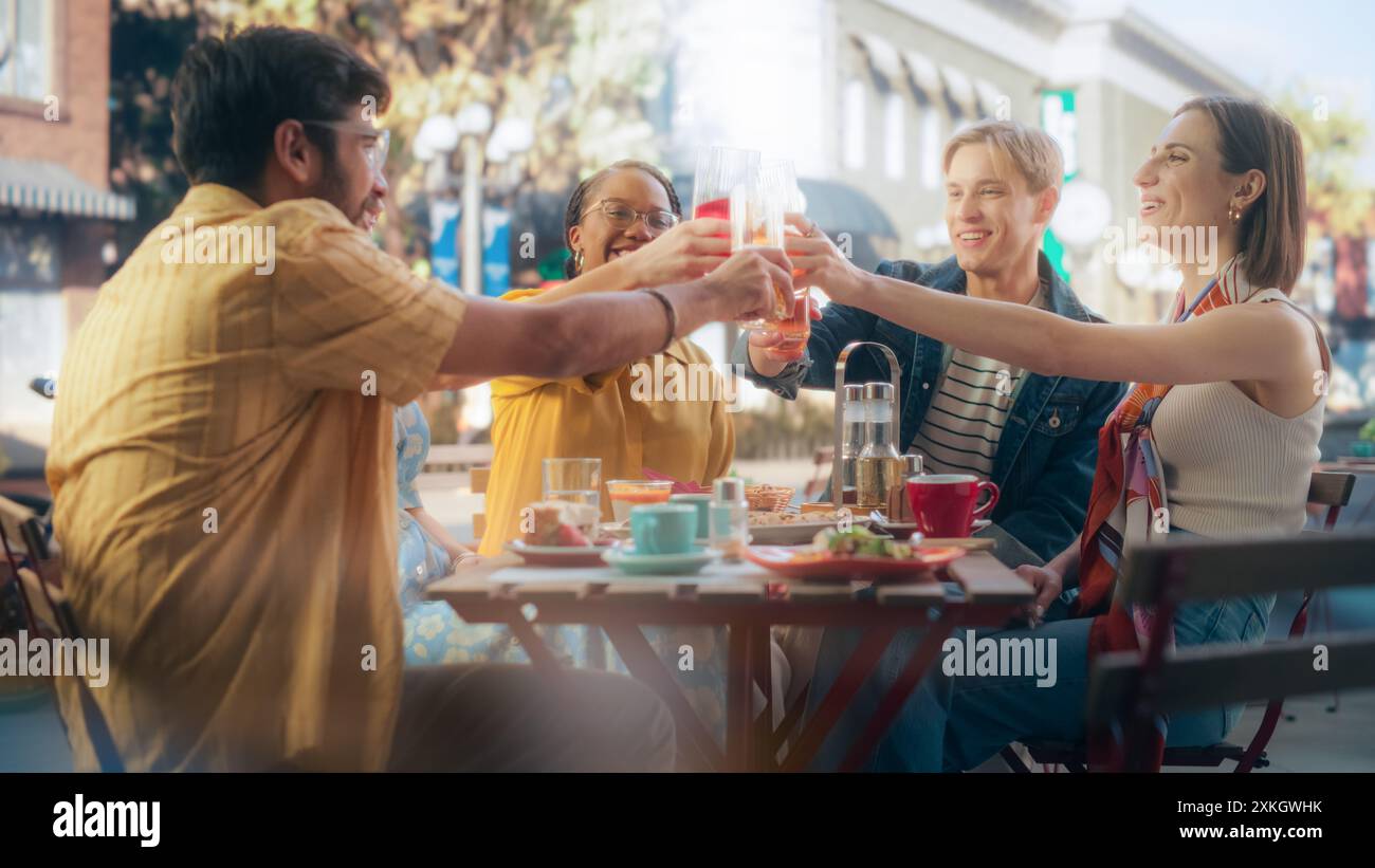 Beautiful woman raising toast cocktail hi-res stock photography and ...