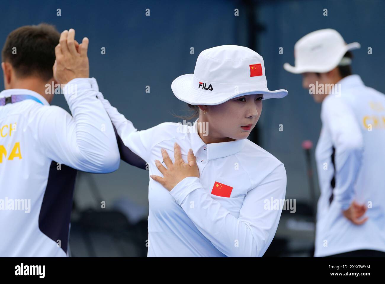 LI Jiaman, of China, stretches before shooting during a training ...