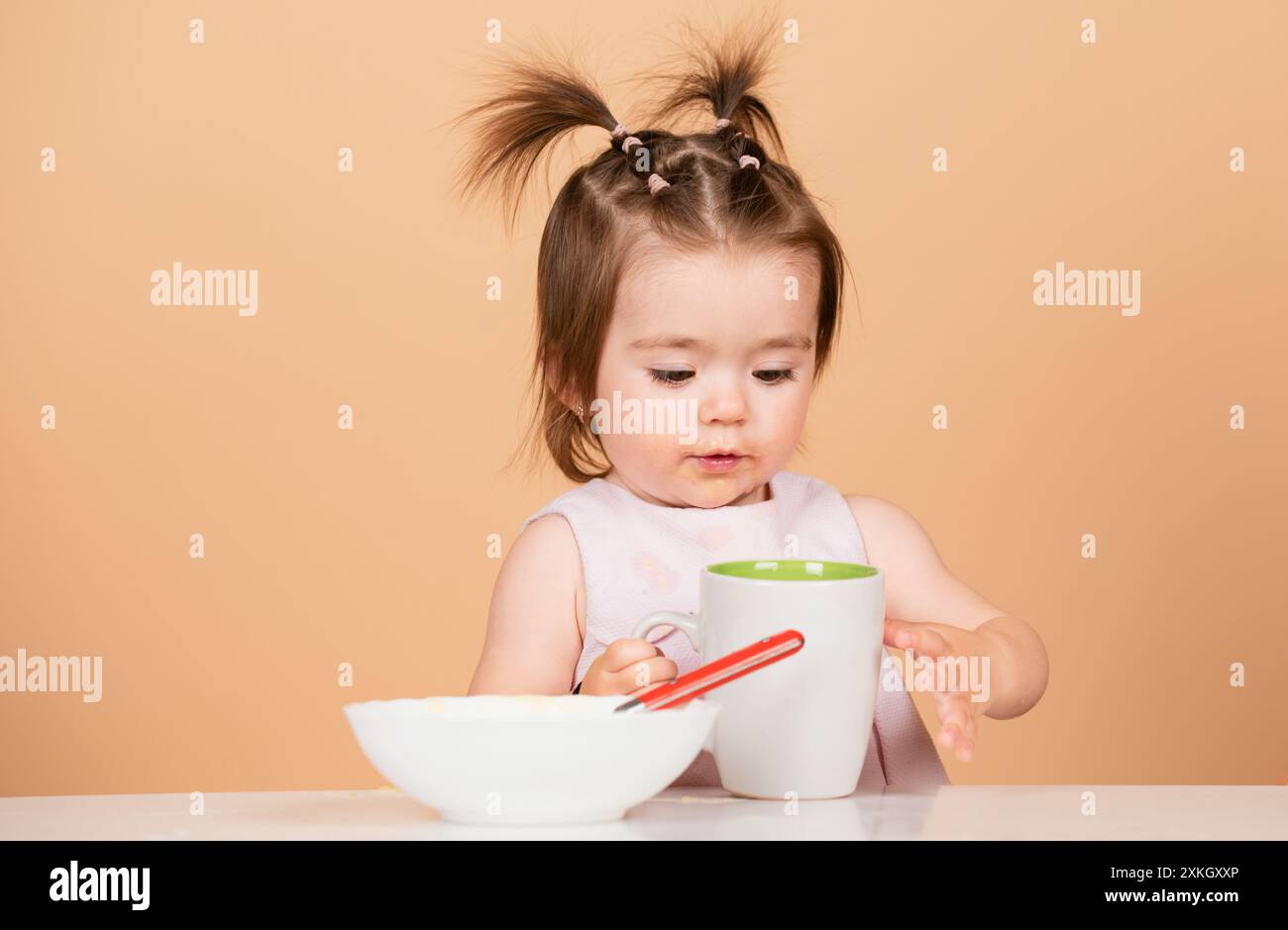Babies eating, healthy food for a baby. Babys first meal. The child ...