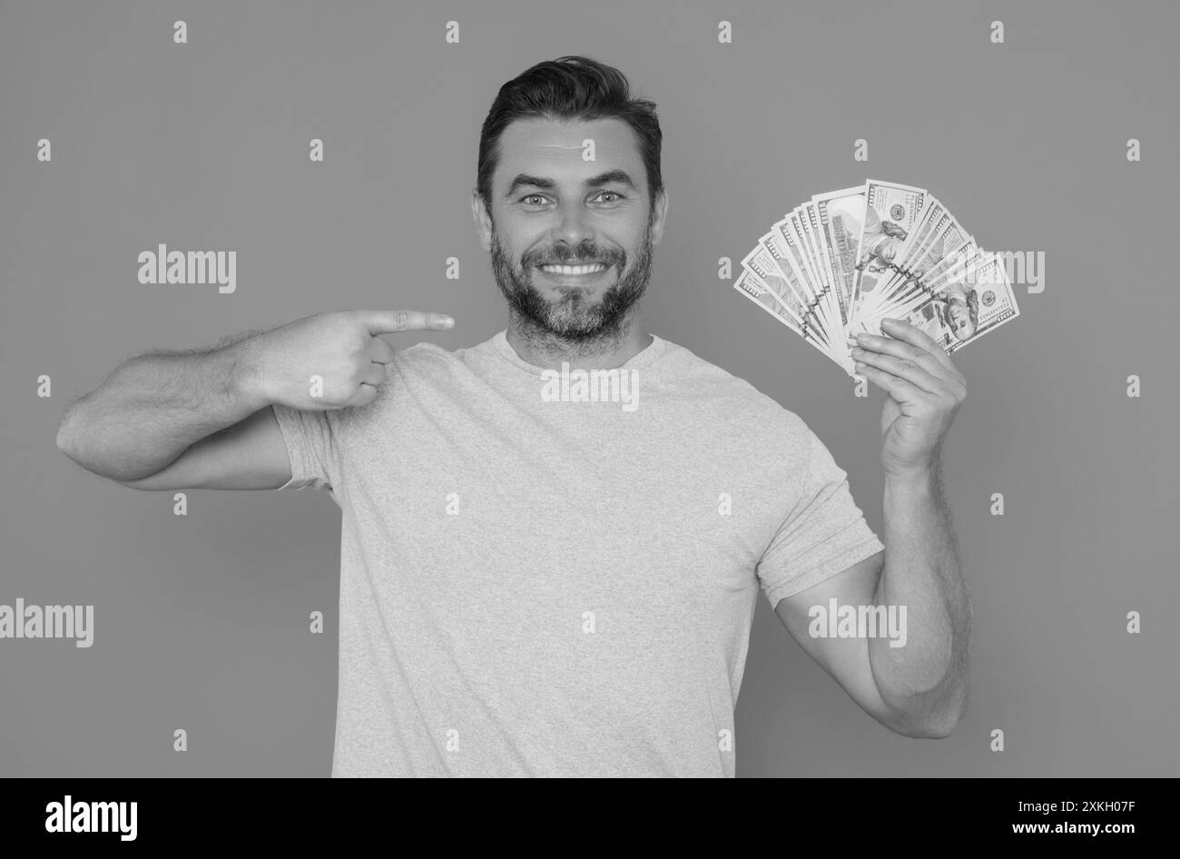 Attractive business man counting money. Handsome middle age man holding ...