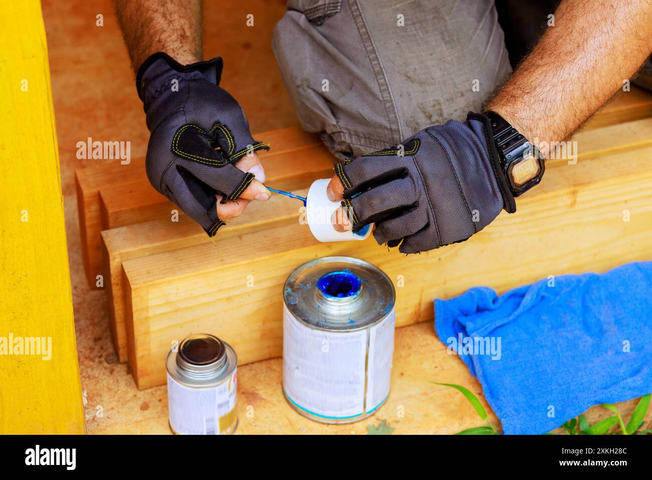 Building contractor installing plastic PVC pipes for installation of ...