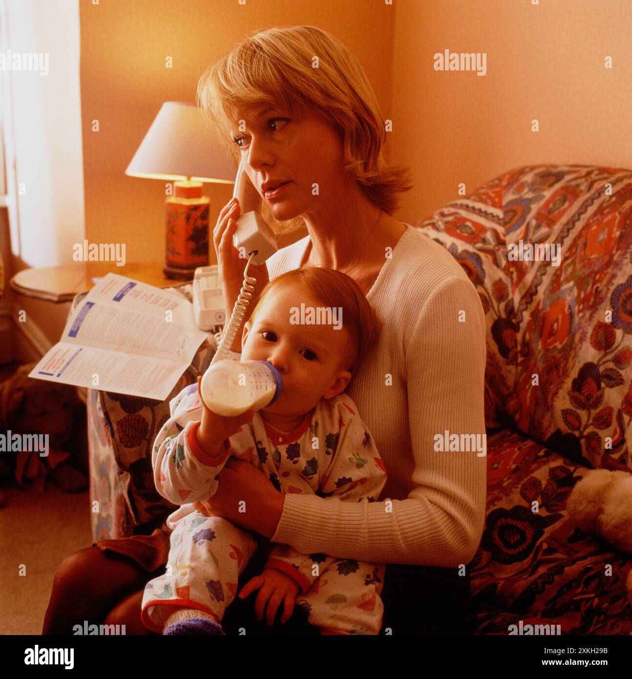 Family. Mother and baby indoors Stock Photo - Alamy