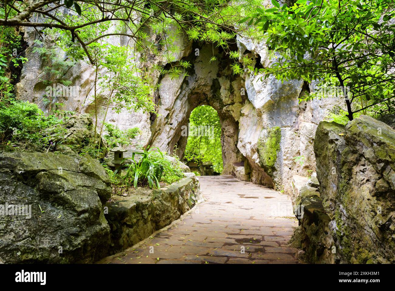 Scenic stone walkway leading to gate in rocks Stock Photo - Alamy