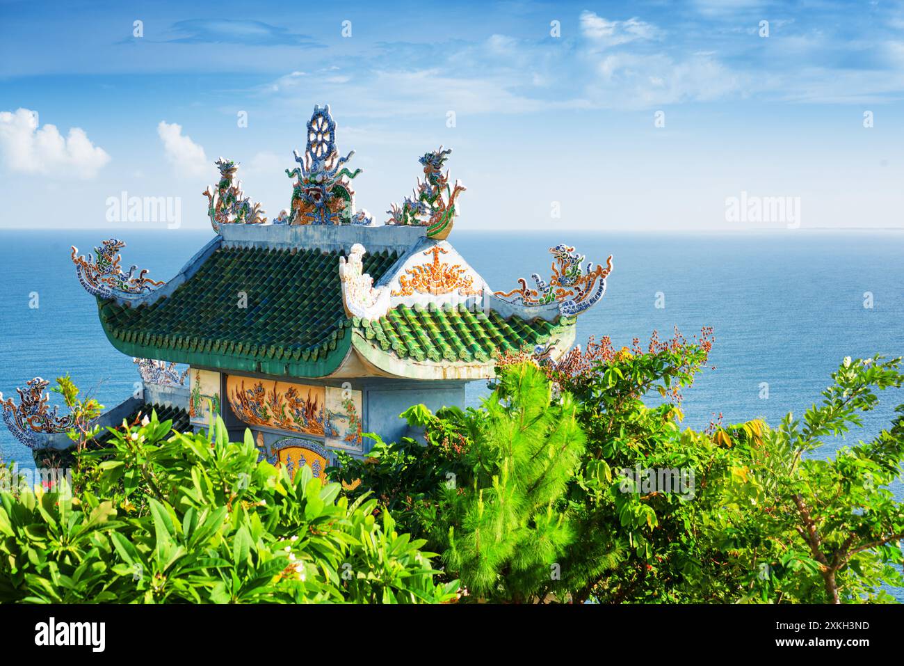 Tile roof of Buddhist temple among foliage on sea background Stock ...