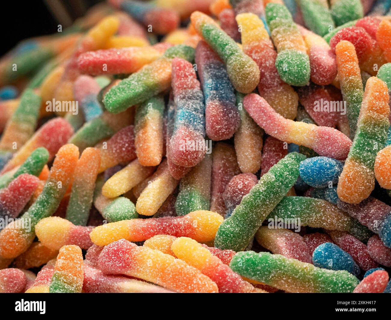 Many Assorted rainbow colorful worm gummy candies Jelly Stock Photo - Alamy