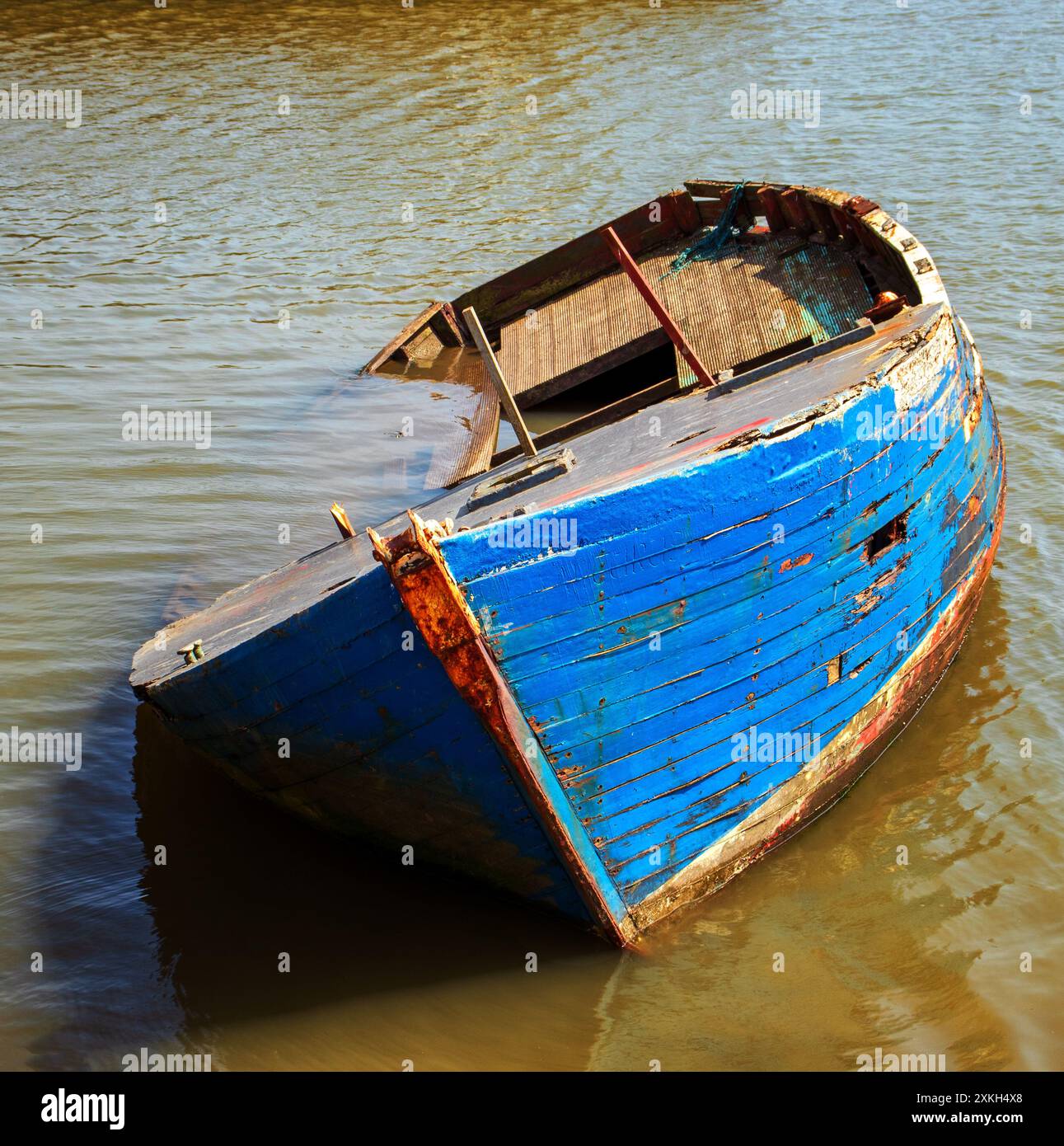 A small wrecked boat at high tide close to the old Fleetwood docks ...
