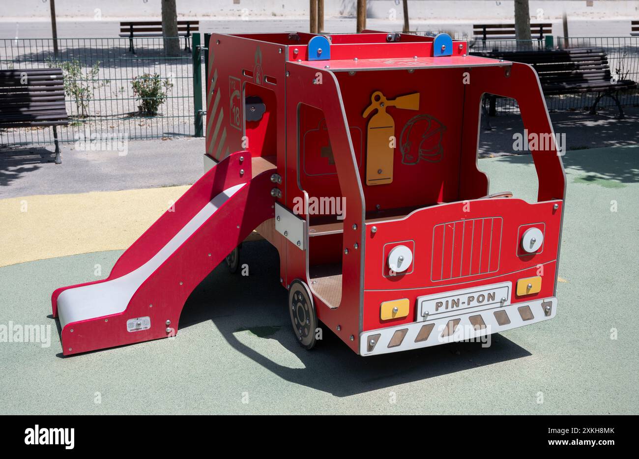Red fire engine slide in a childrens playground, Provenc, France Stock ...