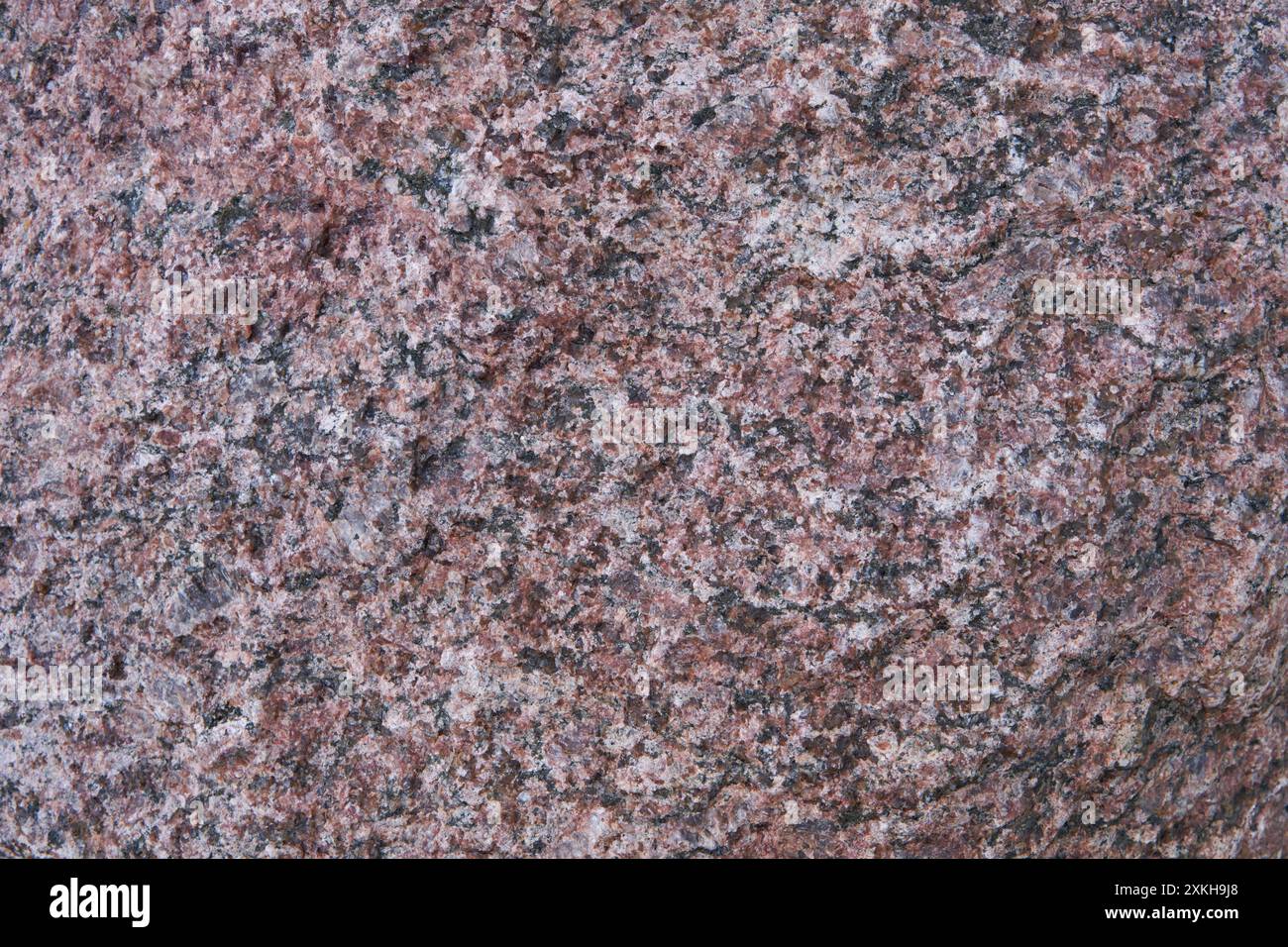 Large granite stone boulder texture background. Red granite old boulder ...