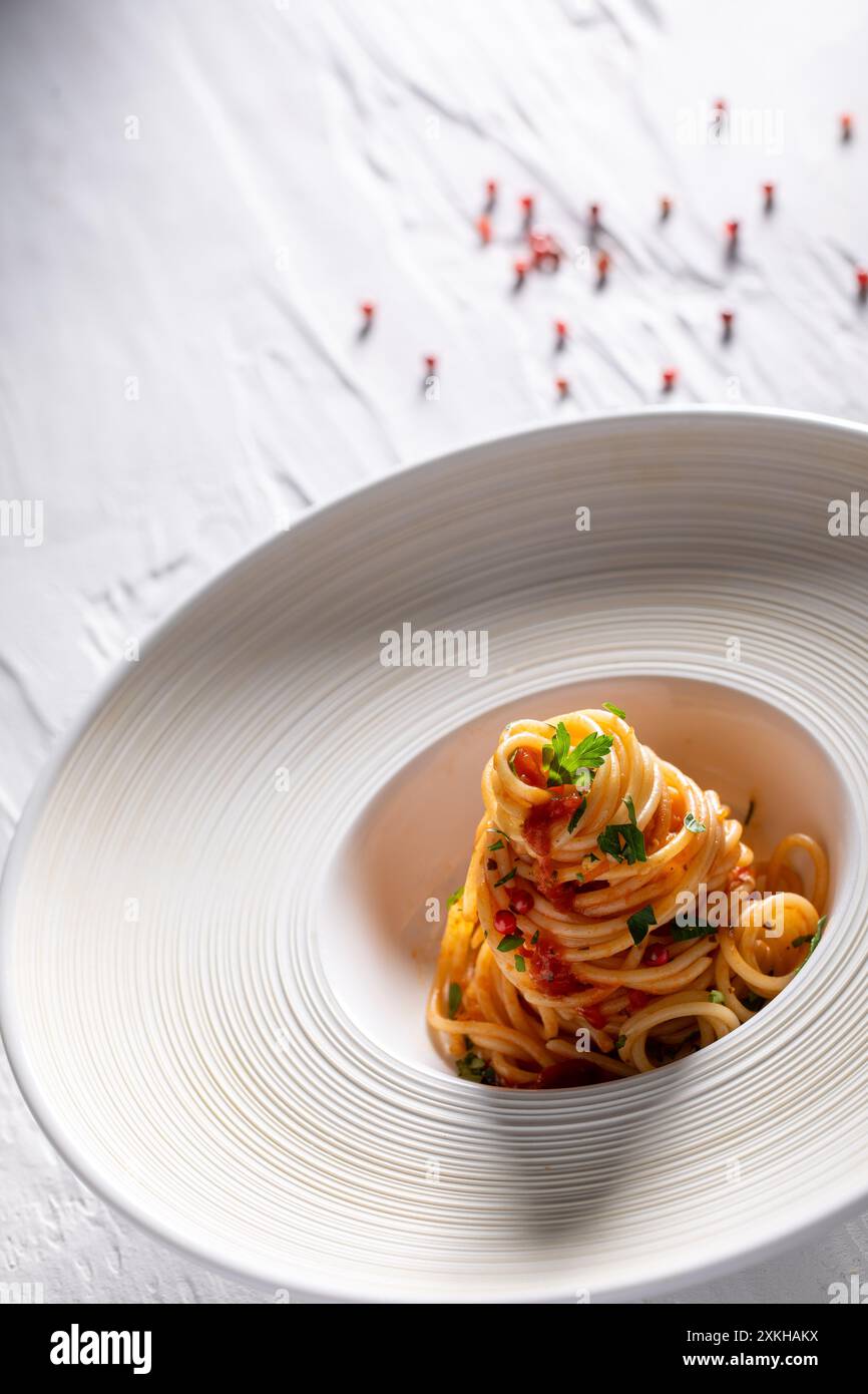 Spaghetti in white plate and white background Stock Photo - Alamy