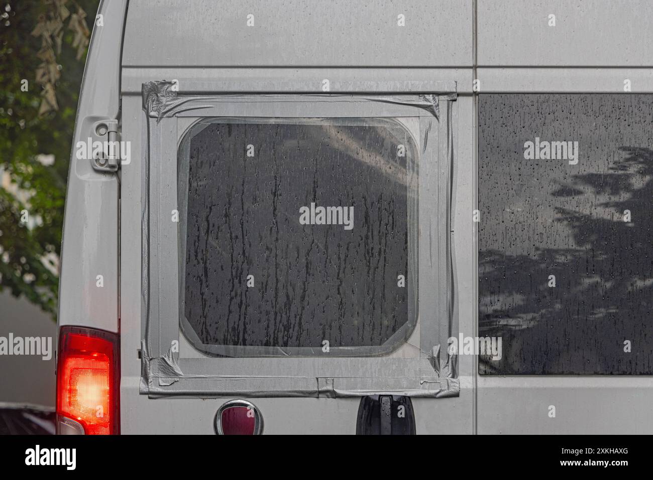 Broken Rear Window Covered With Plastic and Tape at Camper Van Stock ...