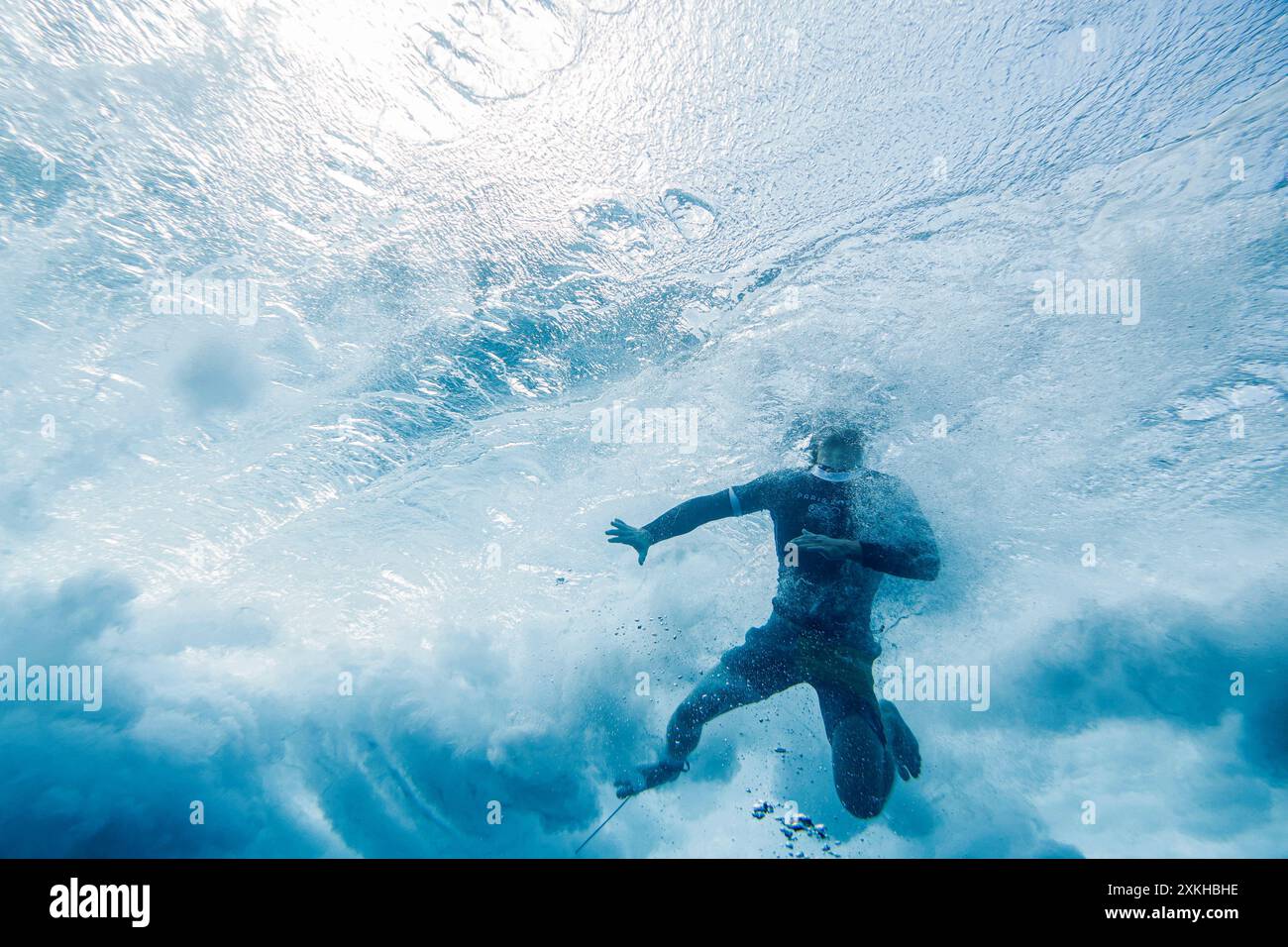 Tahiti, French Polynesian. 22nd July, 2024. A surfer takes part in a ...