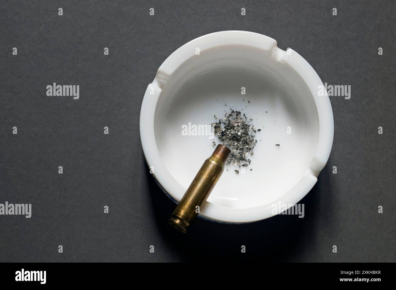 bullet cartridge on ash tray Stock Photo - Alamy