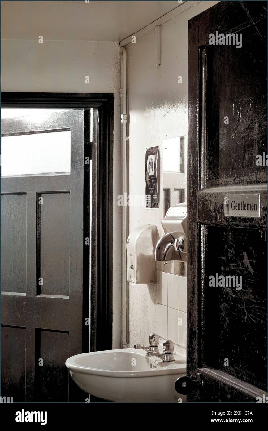 gents toilet in old run down redundant pub bungay suffolk england Stock ...