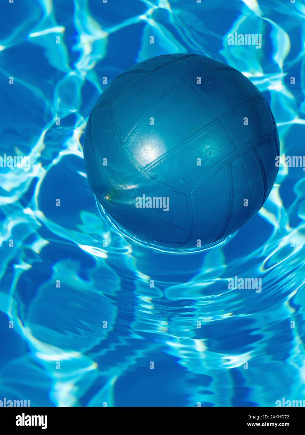 ball floating on shimmering pool surface Stock Photo - Alamy