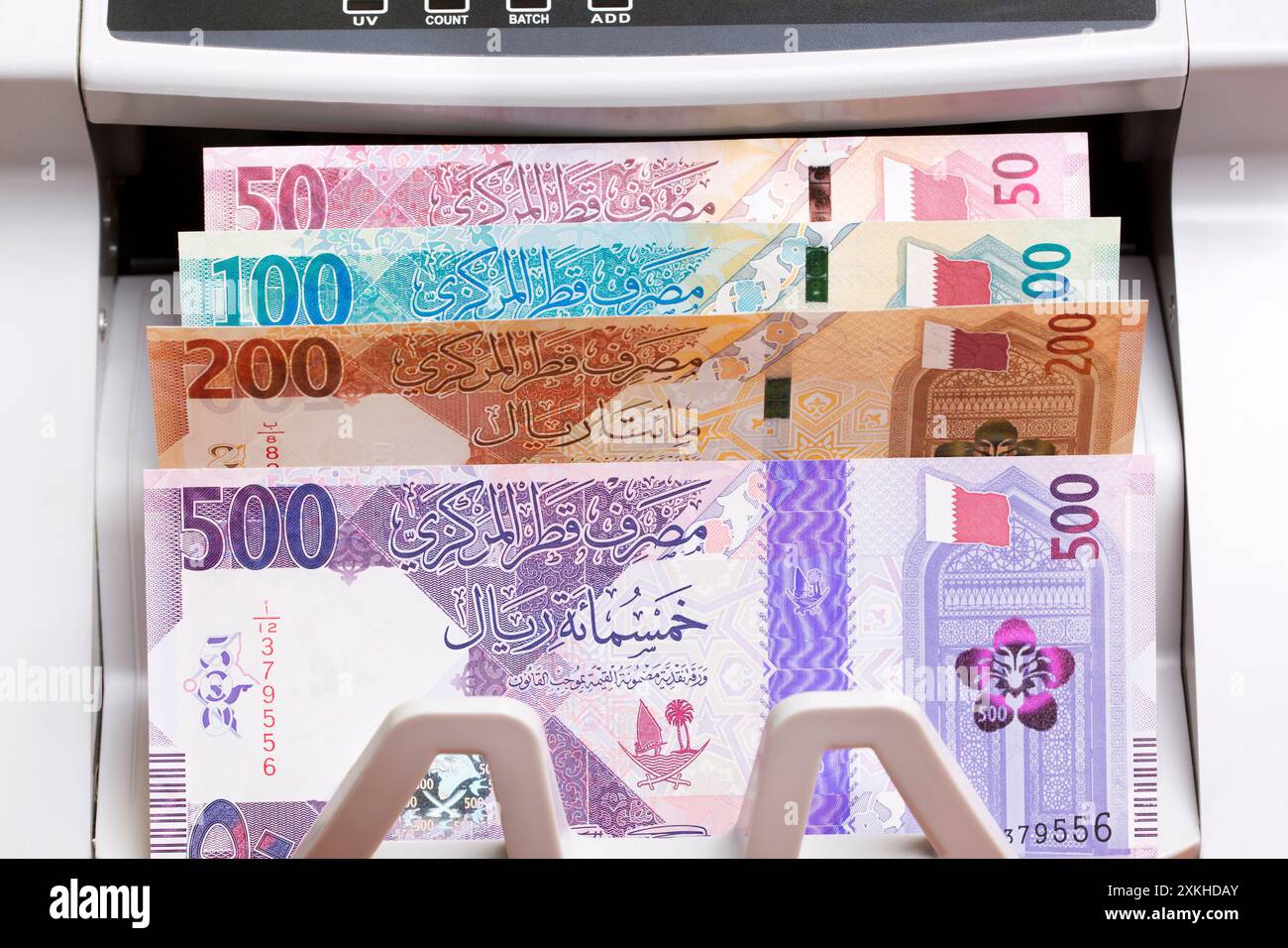 Qatari money - riyal in the counting machine Stock Photo - Alamy