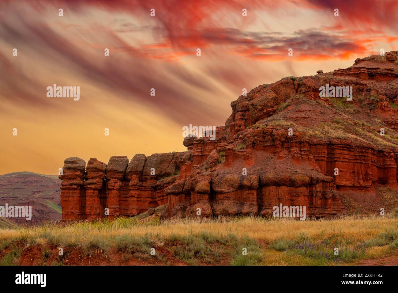 Red fairy chimneys shaped like formations that are millions of years ...
