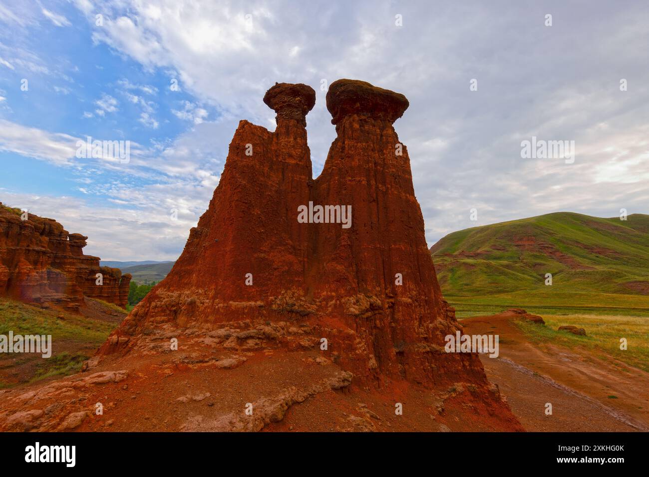 Red fairy chimneys shaped like formations that are millions of years ...