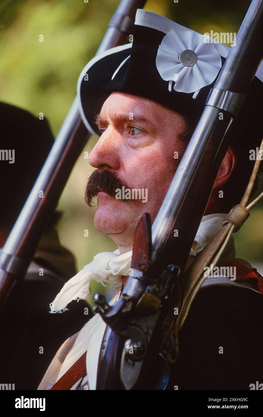 PORTRAIT OF SOLDIER IN PERIOD UNIFORM AT REVOLUTIONARY ENCAMPMENT ...