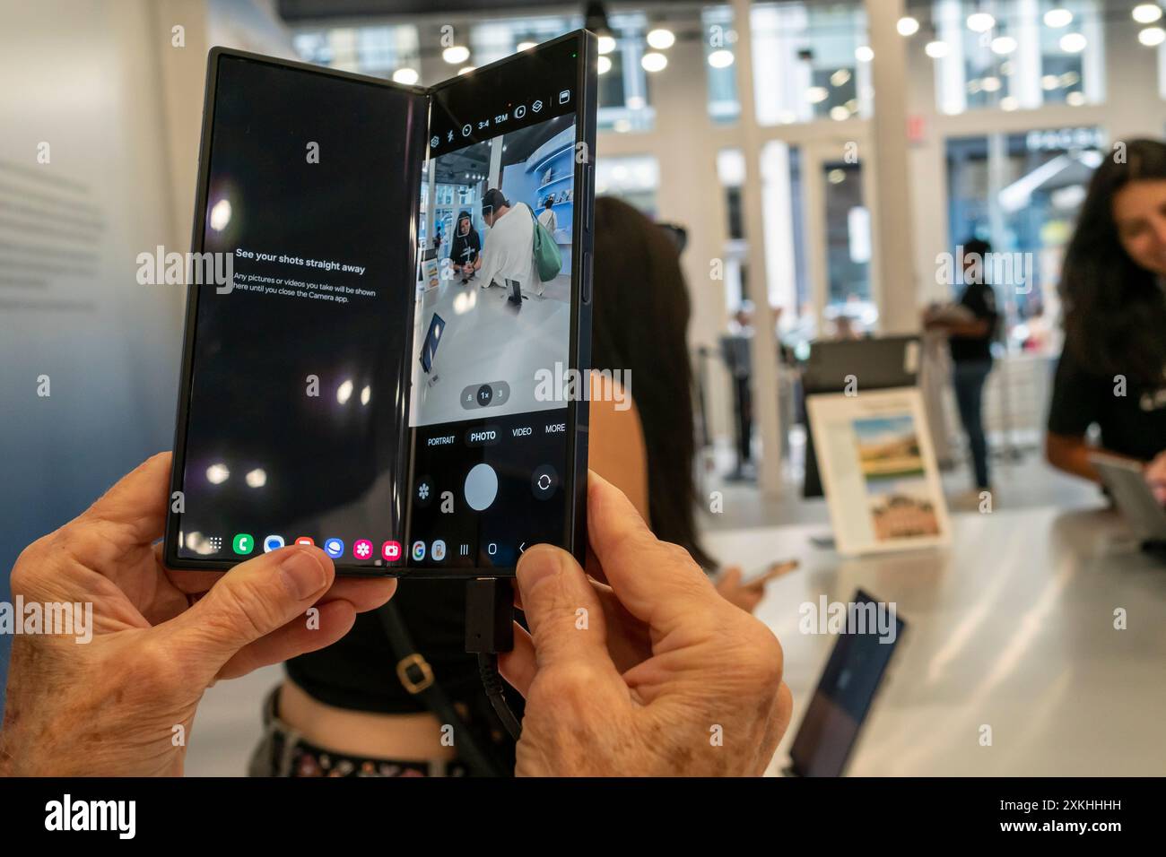 Visitors to the Samsung Galaxy pop-up event in Soho in New York admire ...