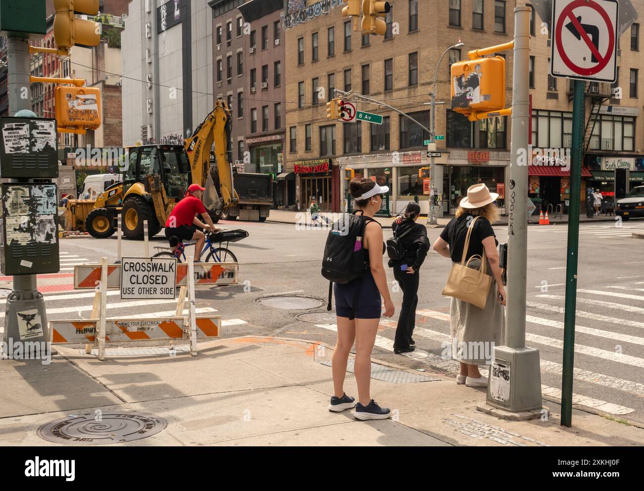 Busy street corner in the Chelsea neighborhood in New York on Saturday ...